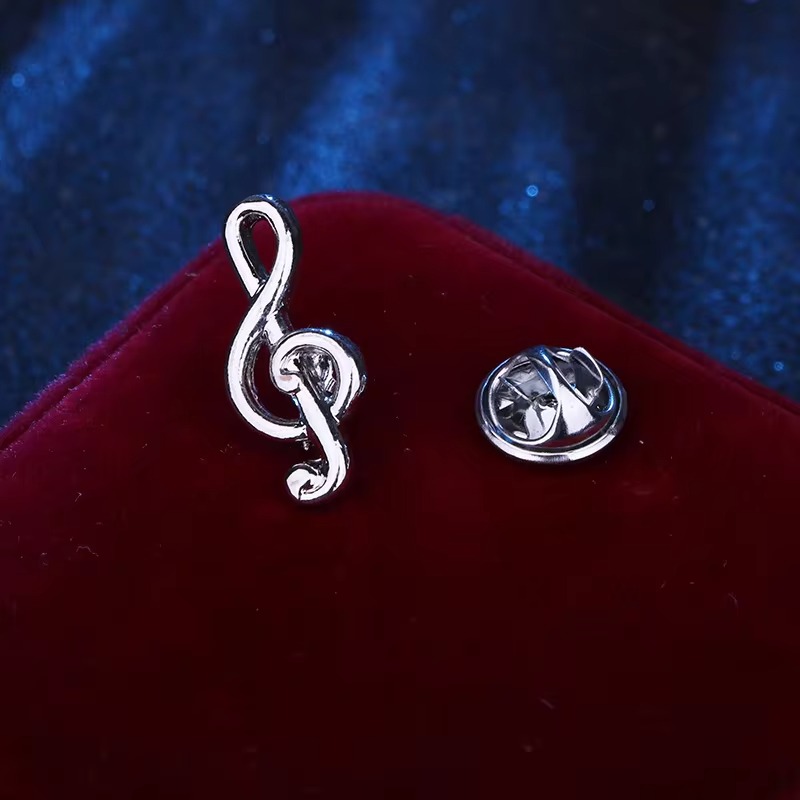 Pin nota musical plateada – Kumora Ties